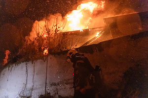SOPA Images - Gallery - Firefighters extinguish a fire after a Russian ...